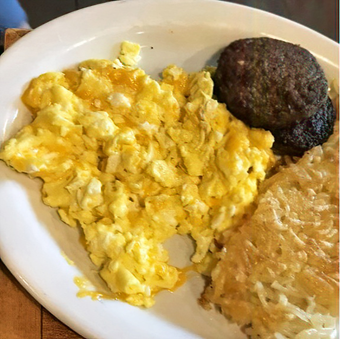 Scrambled eggs so fluffy they could float away, hash browns with the perfect crisp, and a sausage patty that means business.