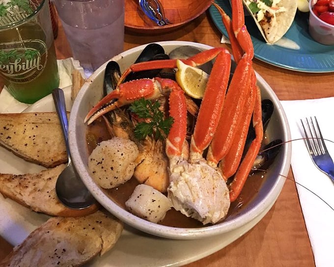 This seafood cioppino doesn't just have crab legs &ndash; they're reaching out of the bowl as if to say, "Pick me first!" A maritime treasure chest in edible form.