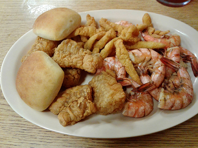The seafood plate that makes you forget you're in North Florida. Those rolls aren't just bread—they're strategic gravy-sopping devices.