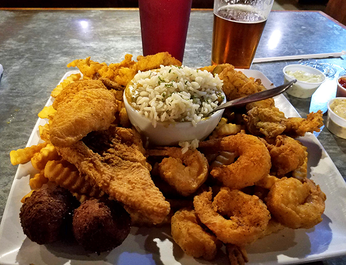 This seafood platter isn't just a meal; it's a maritime celebration with enough fried goodness to make your cardiologist wince and your soul sing.