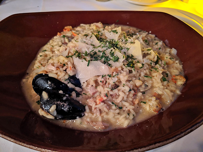 Seafood risotto that's basically a treasure chest from the ocean, with each grain of rice soaking up flavors like tiny flavor sponges.