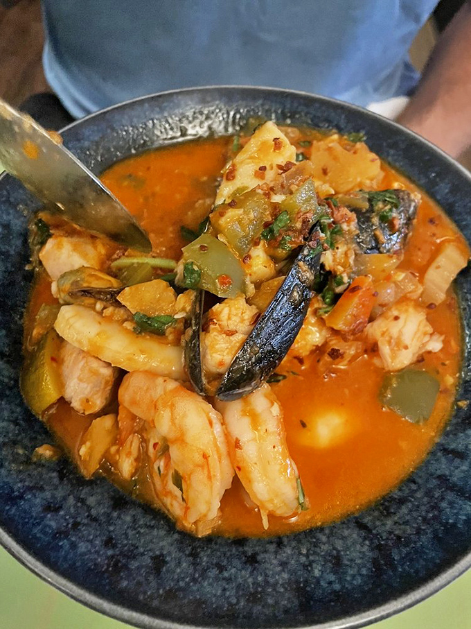 A seafood stew that could make Neptune himself swim to shore. Mussels, shrimp, and fish swimming in spicy tomato broth.