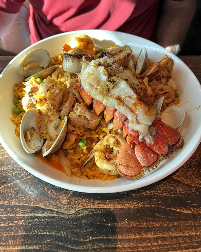 A seafood paella that's essentially a party in a bowl. Lobster tail lounging atop saffron rice like it's sunbathing on California's most exclusive beach.