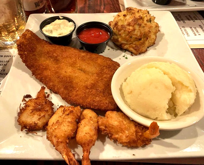 The seafood platter that answers the eternal question: "Why choose one when you can have it all?" Mashed potatoes included for emotional support.