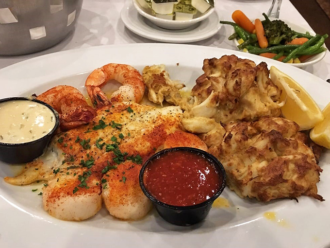 This seafood platter doesn't just feed you—it throws a maritime celebration on your plate, with crab cakes playing the role of honored guests.