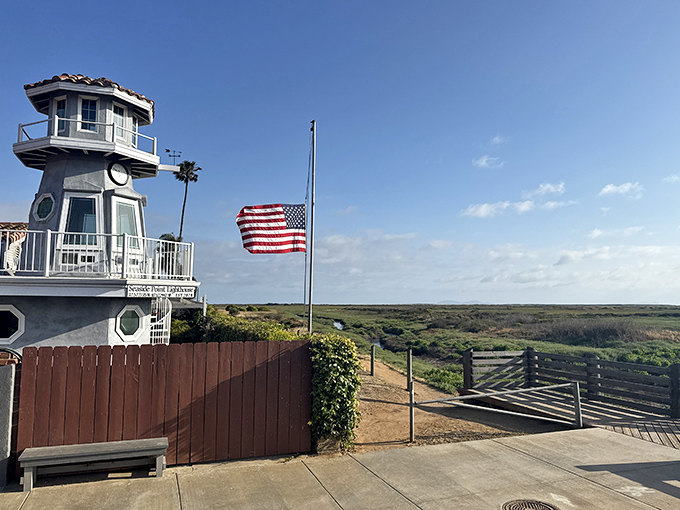 The Seaside Point Lighthouse overlooks coastal wetlands, proudly flying the American flag while symbolizing Imperial Beach&rsquo;s nautical spirit and charm.
