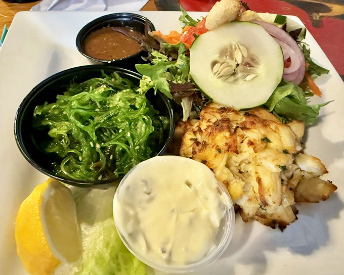 A plate that tells a story of the sea&mdash;crab cake as the protagonist, seaweed salad as the supporting character, and your taste buds as the grateful audience.