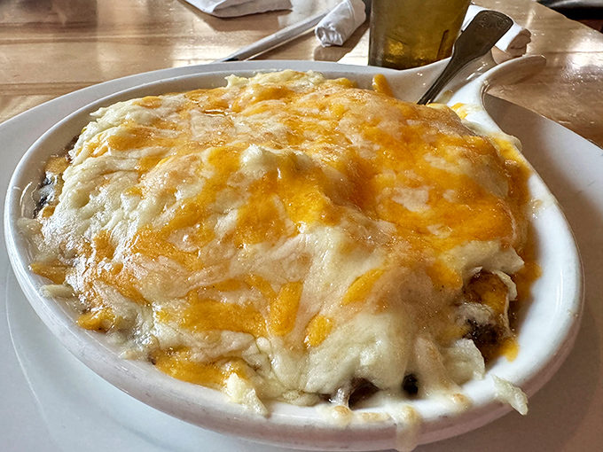 Shepherd's pie that would make an Irish pilot do a victory roll—bubbling cheese blanketing savory meat and vegetables like a comforting culinary cloud cover.