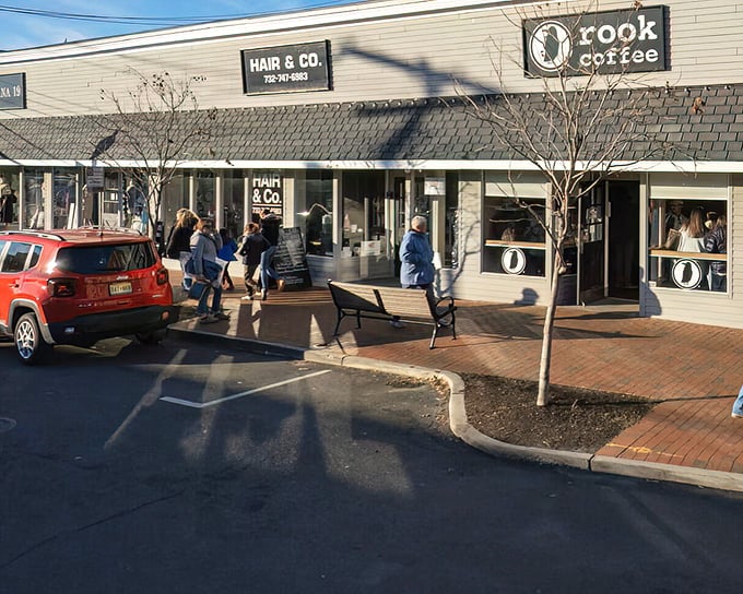 Rook Coffee draws locals and visitors alike to this charming strip, where brick walkways and casual bench seating create neighborhood gathering spots.