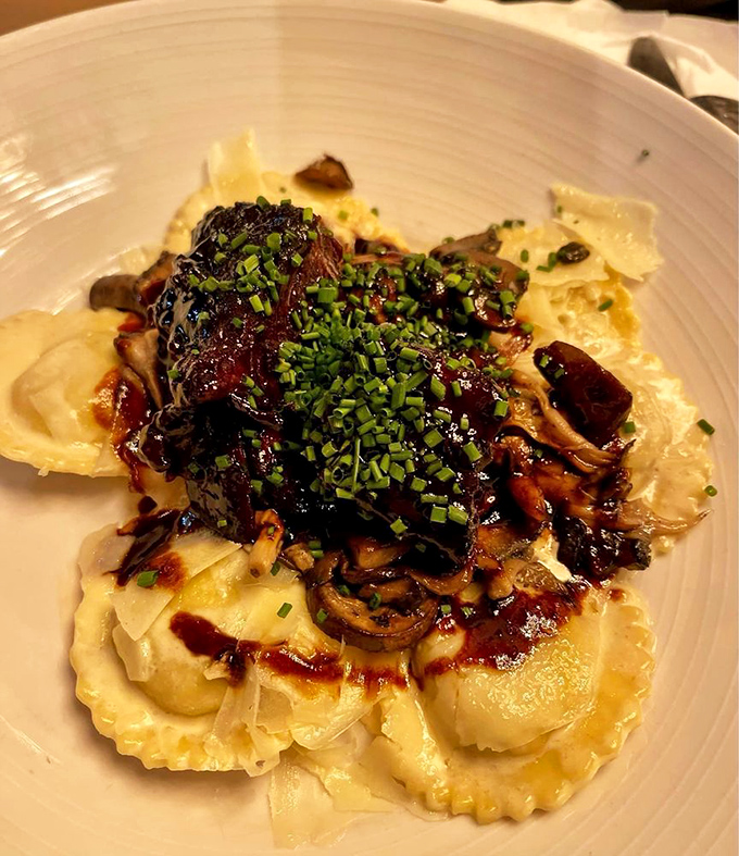 Ravioli swimming in a pool of short rib and mushroom glory &ndash; proof that pasta can dress up for a night out and still be comforting.