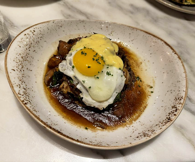 Beneath that sunny-side-up egg lies a short rib hash so rich and flavorful it might make you forget pancakes ever existed.