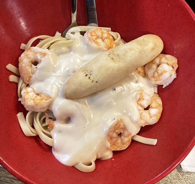 Creamy alfredo sauce blankets tender shrimp and pasta&mdash;proof that New England seafood houses know their way around Italian classics too.