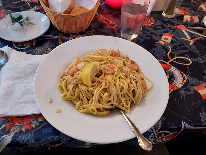 Pasta that's found its soulmate in shrimp and cream sauce. That lemon wedge isn't just garnish&mdash;it's the bright note that ties the whole symphony together.
