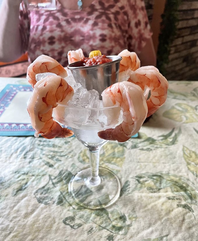 Shrimp cocktail that means business&mdash;plump crustaceans hanging off the glass like they're trying to escape their delicious fate. The cocktail sauce awaits its moment.