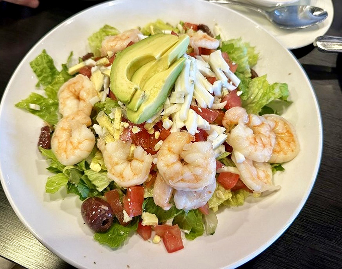 Who said salads can't be exciting? This shrimp-topped creation with avocado and fresh greens proves healthy eating doesn't mean flavor sacrifice.