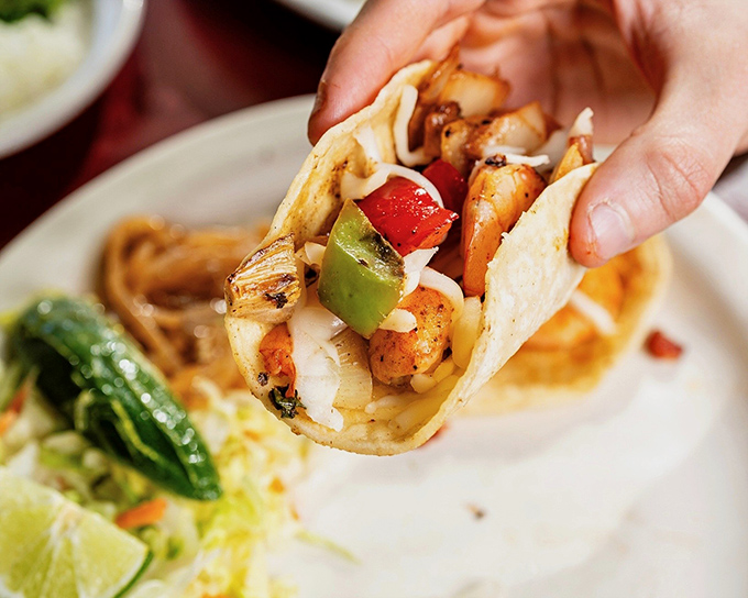 A taco that understands balance&mdash;plump shrimp, crisp vegetables, and a squeeze of lime. Proof that perfection often comes in small packages.