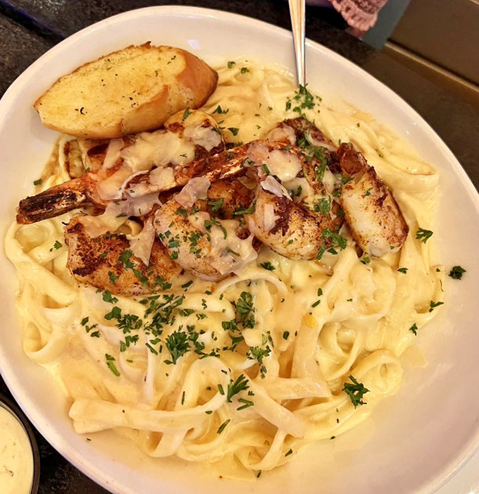 Pasta that makes carb-counting a tomorrow problem. Plump shrimp and tender lobster nestled in creamy fettuccine – comfort food with a coastal upgrade.