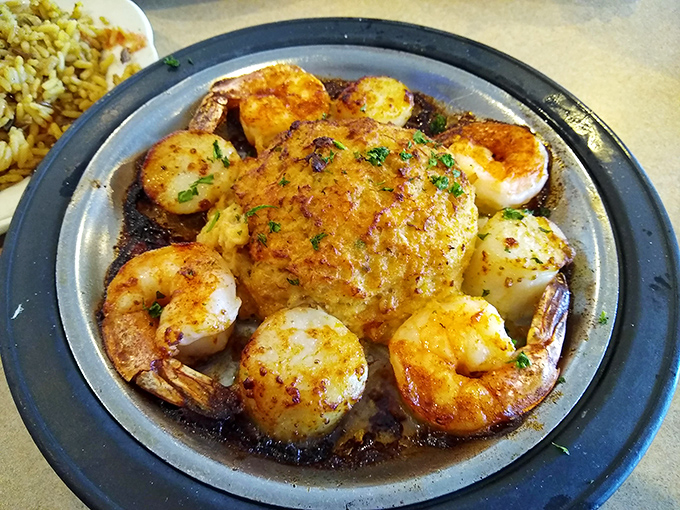 Shrimp and scallops sizzle on the plate, creating a seafood symphony that would make coastal chefs jealous.