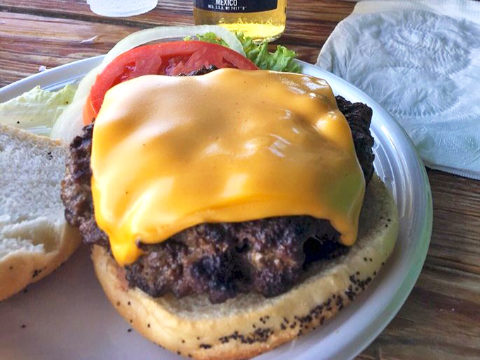 This isn't just a burger &ndash; it's a monument to beef. The melted cheese cascades down the sides like a yellow waterfall of deliciousness.