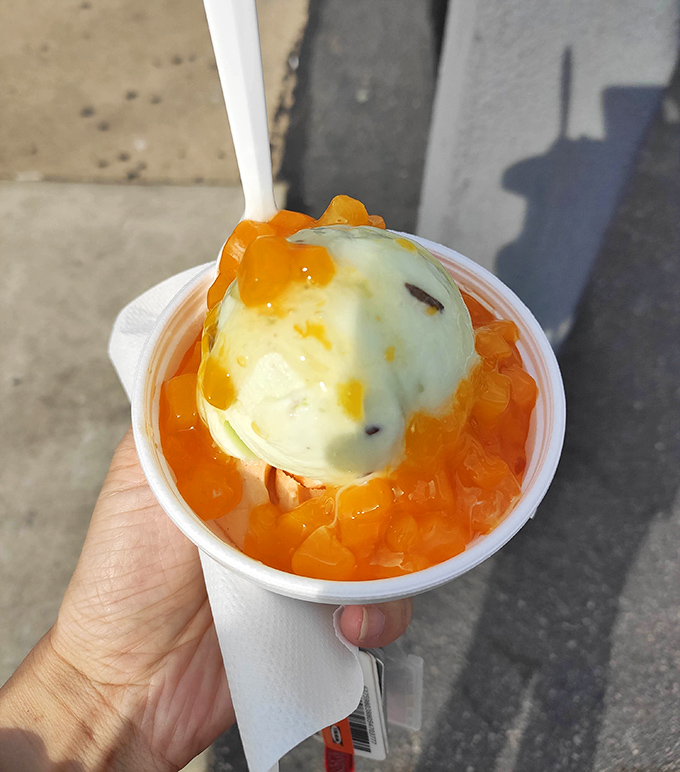 Peach ice cream swimming in its own juices&mdash;proof that sometimes the simplest combinations are culinary poetry in a cup.