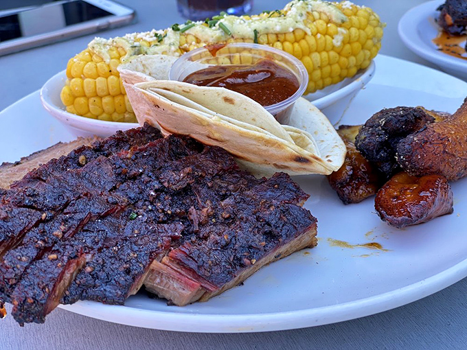 Brisket so perfectly crusted and juicy it would make a Texan tip their hat in respect. That smoke ring is practically a halo.
