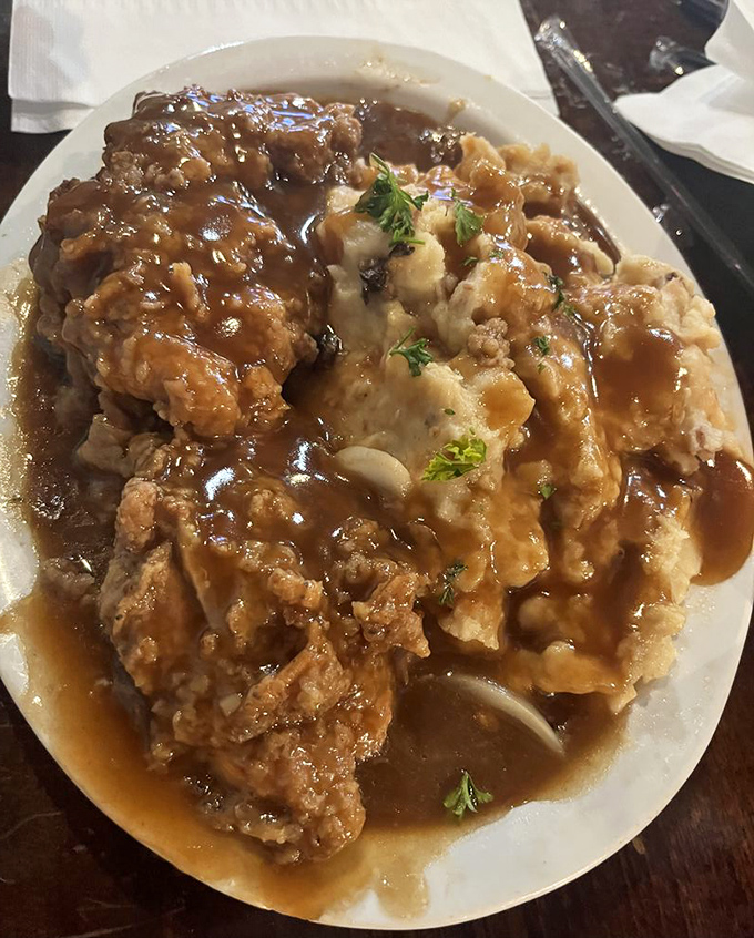 Smothered chicken and mashed potatoes drowning in gravy&mdash;the kind of dish that makes you want to cancel your afternoon plans for a well-deserved nap.