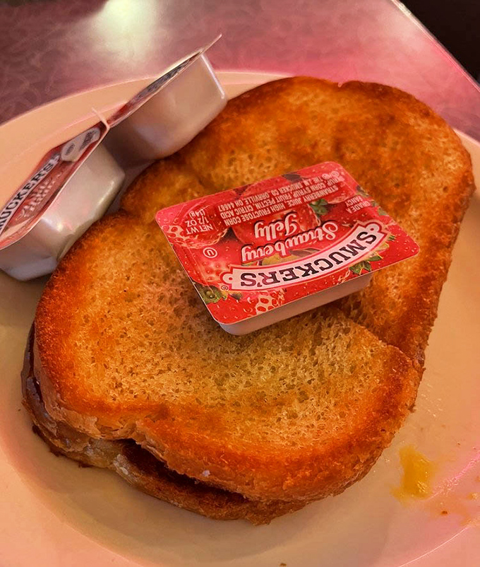Golden-brown toast that's actually worthy of its own photo. Smuckers jelly packet optional, but highly recommended for the full experience.