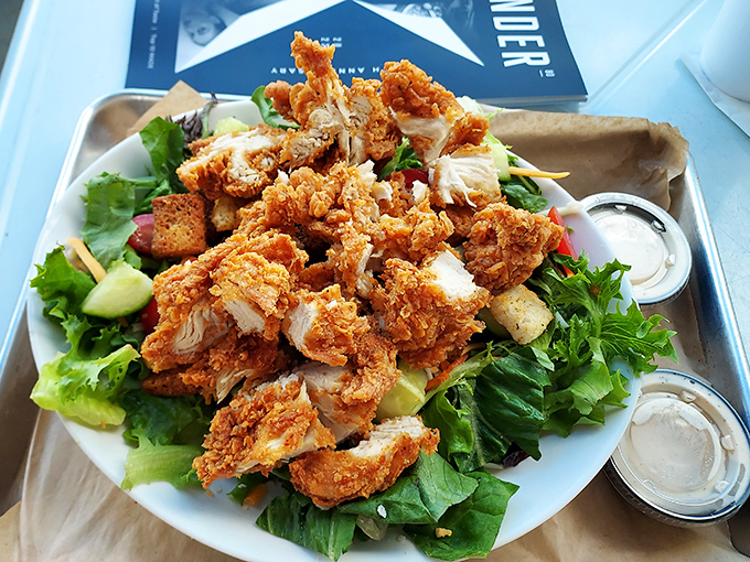 Even the salad gets the rock star treatment. Crispy chicken pieces lounging on greens like they own the place.