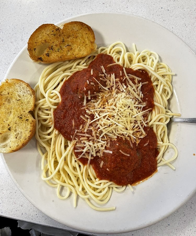 Spaghetti with marinara and garlic bread—proof that sometimes the simplest pleasures are the most satisfying, especially after midnight.