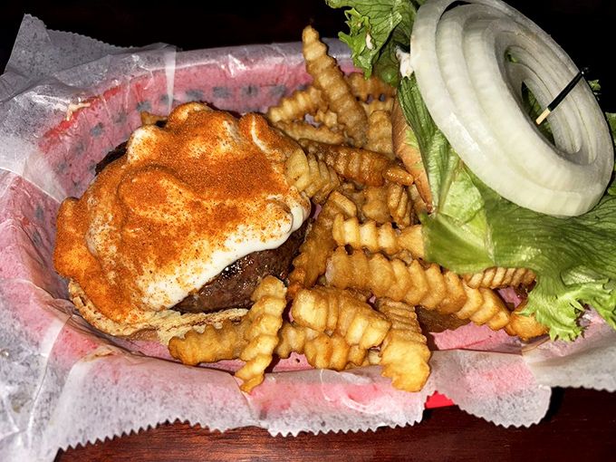 A burger that knows how to dress for dinner &ndash; juicy patty, crispy fries, and that thick slice of onion that says "I'm not here to mess around." 