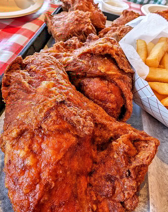 A mountain of spicy, crispy chicken that makes you understand why people line up outside. That color isn't just for show&mdash;it's a promise of flavor.