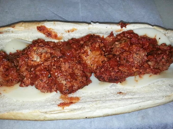 The legendary spicy meatball sandwich in all its saucy glory&mdash;where perfectly formed meatballs nestle in marinara like they've found their forever home.