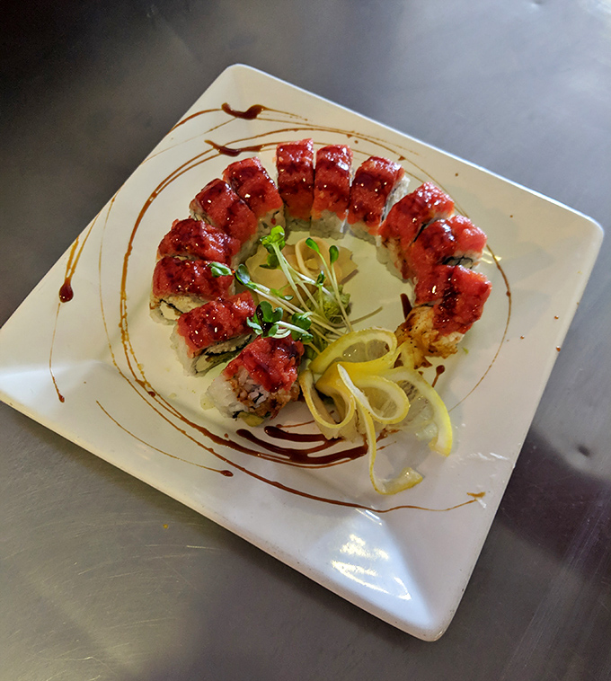 Spicy tuna tartare arranged in a perfect circle &ndash; proof that sometimes the most beautiful art belongs on a plate, not a wall.
