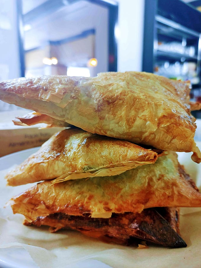These flaky pastry triangles aren't just filled with spinach&mdash;they're packed with Mediterranean sunshine and the kind of flavor that makes you reconsider your life choices.
