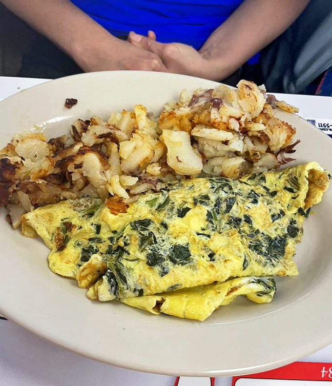 This spinach and feta omelet isn't just breakfast&mdash;it's edible sunshine paired with potatoes that have been properly introduced to butter.