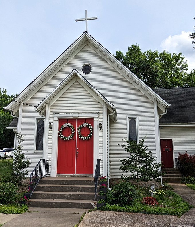 This charming white church with vibrant red doors offers the kind of picture-perfect small-town spirituality that Hallmark movies try desperately to recreate.