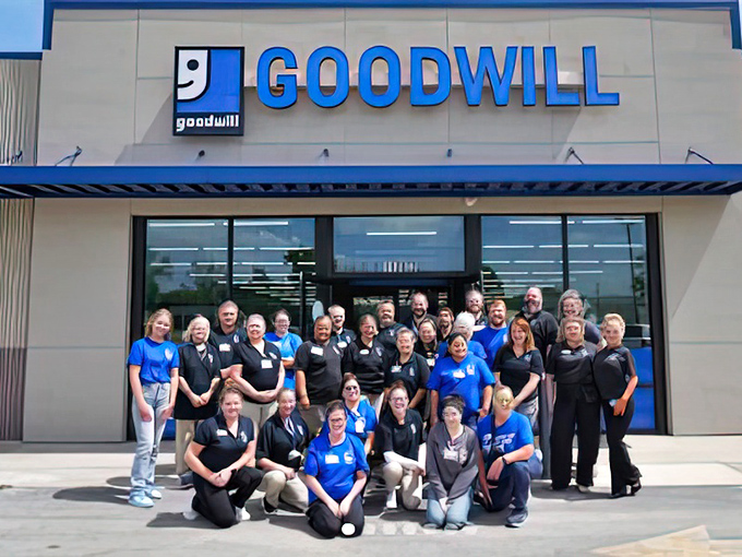 Row after row of blue bins create a landscape of possibility. The thrift store equivalent of "choose your own adventure," where every reach into the depths might change your wardrobe forever.