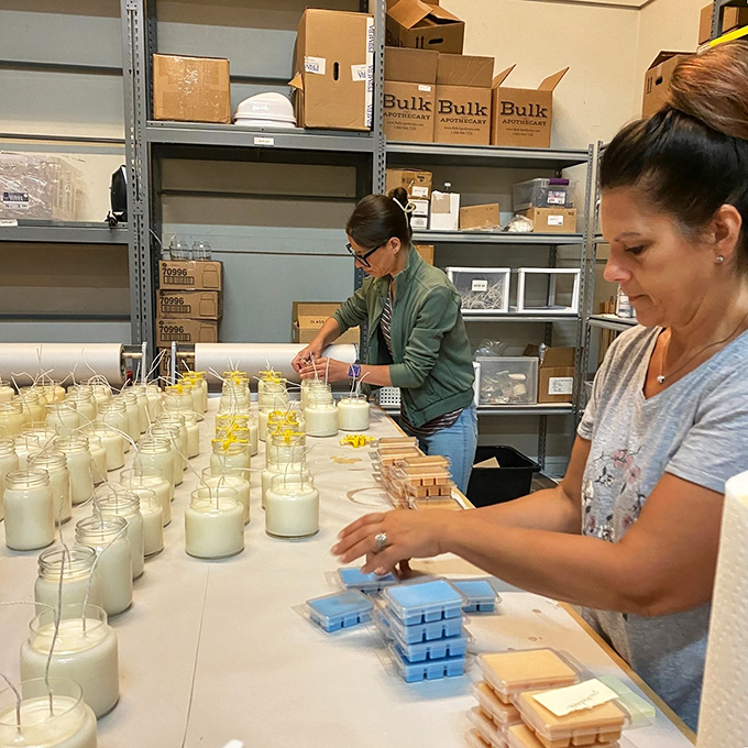 Behind the scenes, staff members craft homemade products. Like elves in Santa's workshop, but with better candle-making skills and no pointy hats.