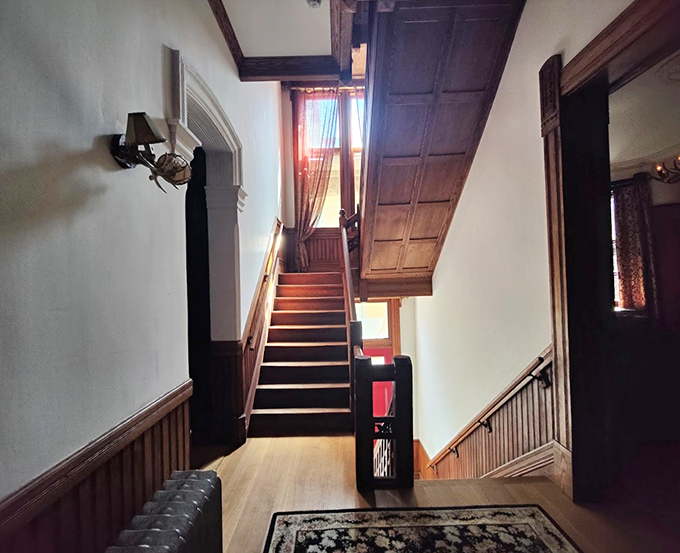 Every haunted mansion needs a proper staircase for mysterious footsteps at midnight. This one delivers architectural drama worthy of Vincent Price.