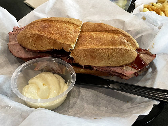 The tri-tip sandwich arrives unadorned and confident, like a Hollywood star who doesn't need makeup, with a side of house-made sauce for dipping.