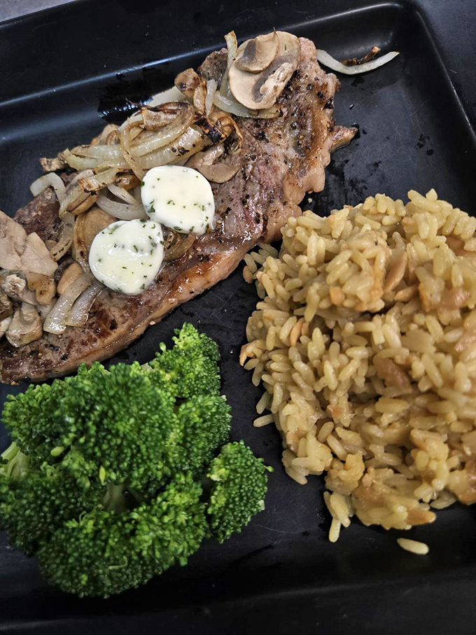 When a steak comes with two pats of herb butter melting into perfect submission, you know someone in the kitchen really cares about you.