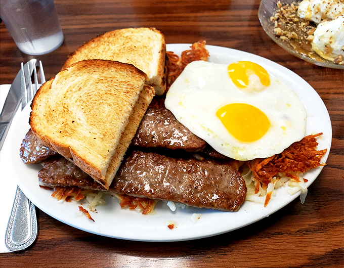 The breakfast of champions isn't cereal&mdash;it's this plate of sausage links, sunny-side-up eggs, and hash browns that could fuel a marathon.