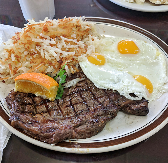 
The classic steak and eggs&mdash;a protein powerhouse that says, "Today might be tough, but your breakfast sure isn't." Those hash browns deserve their own fan club. 