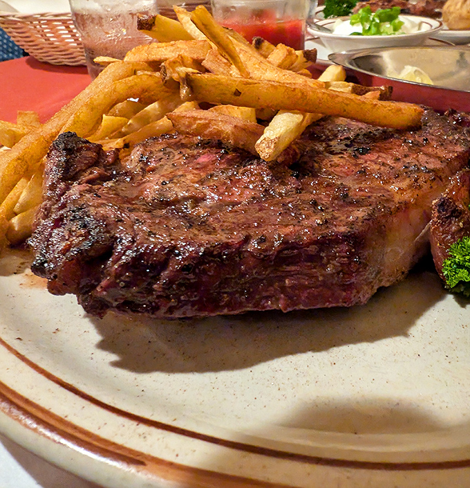This isn't just a steak&mdash;it's a masterclass in simplicity. Oak-grilled perfection with a side of golden fries that demand to be savored.