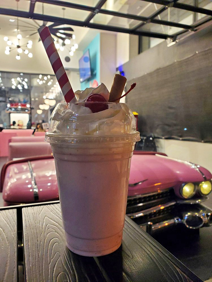 This isn't just a milkshake &ndash; it's a pink cloud of happiness with a straw, served alongside a classic car booth that makes Instagram influencers weak at the knees.
