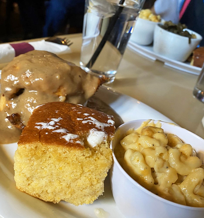 Cornbread that's somehow both fluffy and substantial, mac and cheese that's legally required to be described as "creamy," and something smothered in gravy that demands your attention.