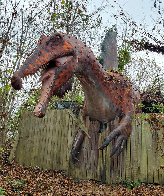This terrifying creation appears to burst through a wooden fence, showcasing the park's flair for dramatic presentations that startle and delight visitors.