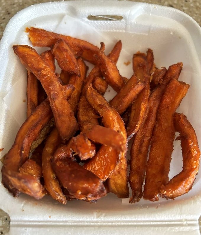 Sweet potato fries with that caramelized exterior that reminds you why sometimes the side dish deserves its own standing ovation.