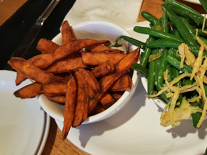 Sweet potato fries that straddle the line between side dish and dessert, keeping company with green beans that didn't skip their vitamin workout.