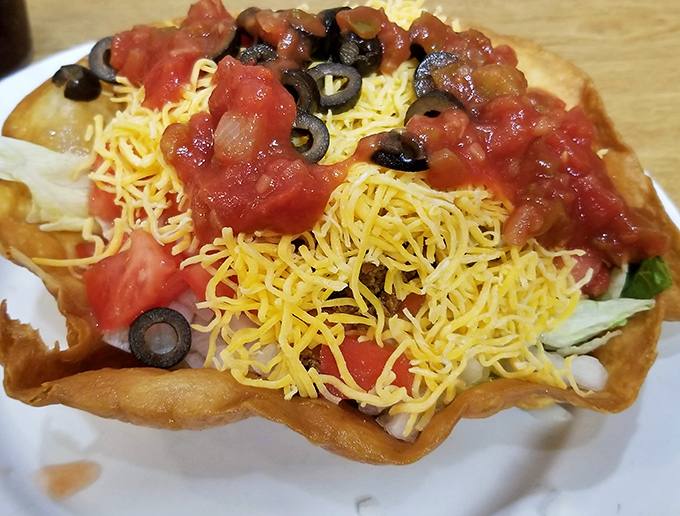 This taco salad in its crispy shell fortress isn't just Tex-Mex &ndash; it's a crunchy, cheesy architectural marvel that demands to be demolished.